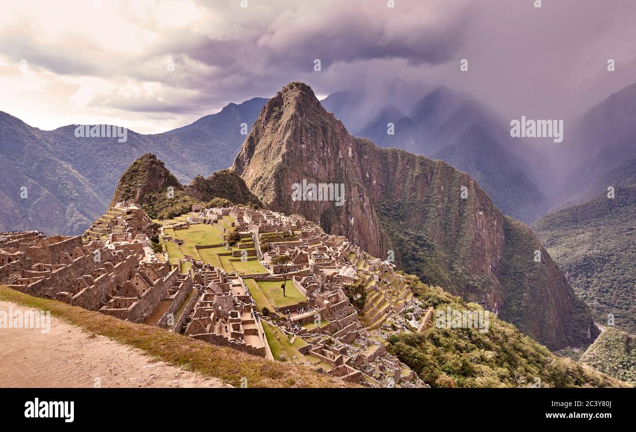 Peru, Machu Pichu, Mountain range and ruins of aztec village Stock ...