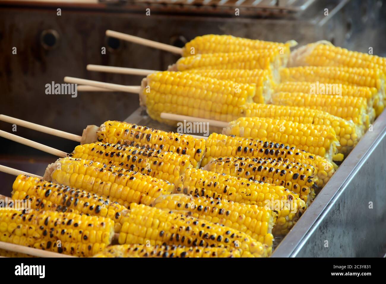 Grilled sweet corn in street food style. Street food snack style in ...