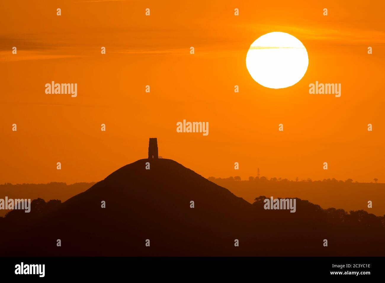Glastonbury, Somerset, UK. 23rd June 2020. UK Weather. The sun rises up ...
