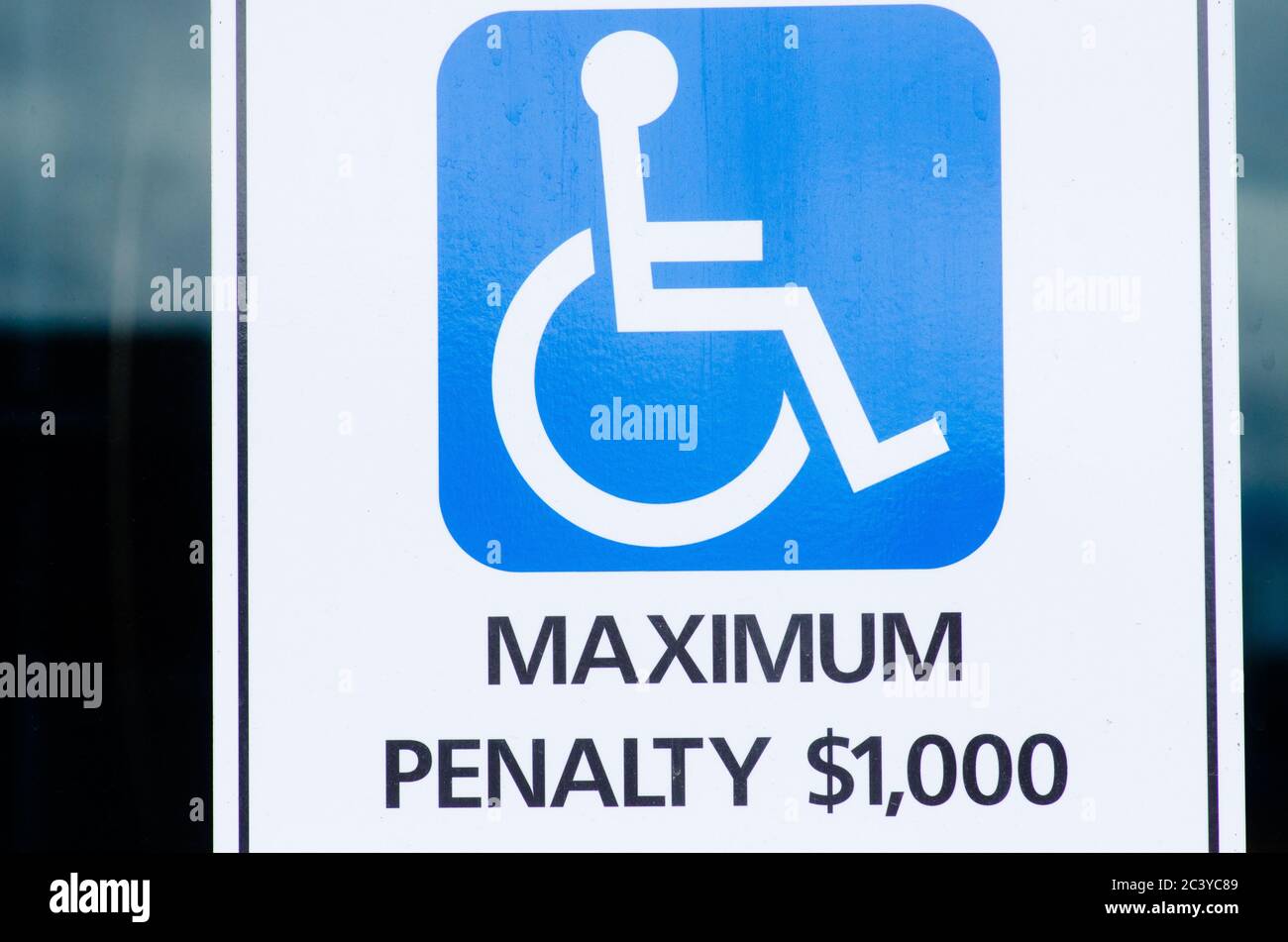 Close up of white on blue Handicapped in wheelchair sign and symbol at ...