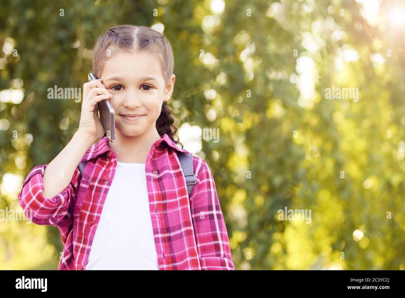 Little girl calling and chat telephony. Busy telephone. Watching Stock ...