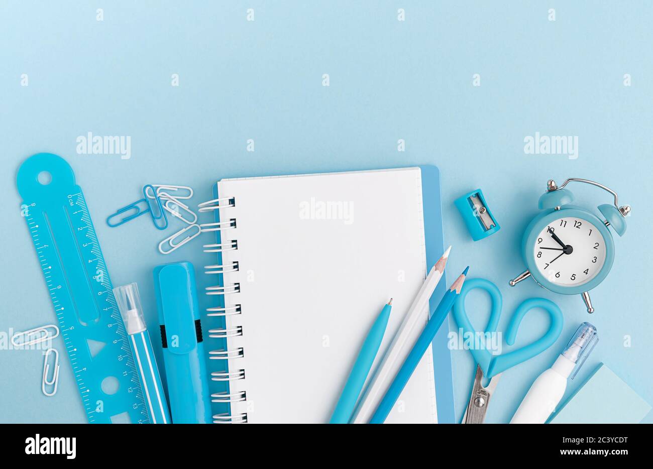 Stationery, school supplies on pastel blue background. Top view, mockup ...
