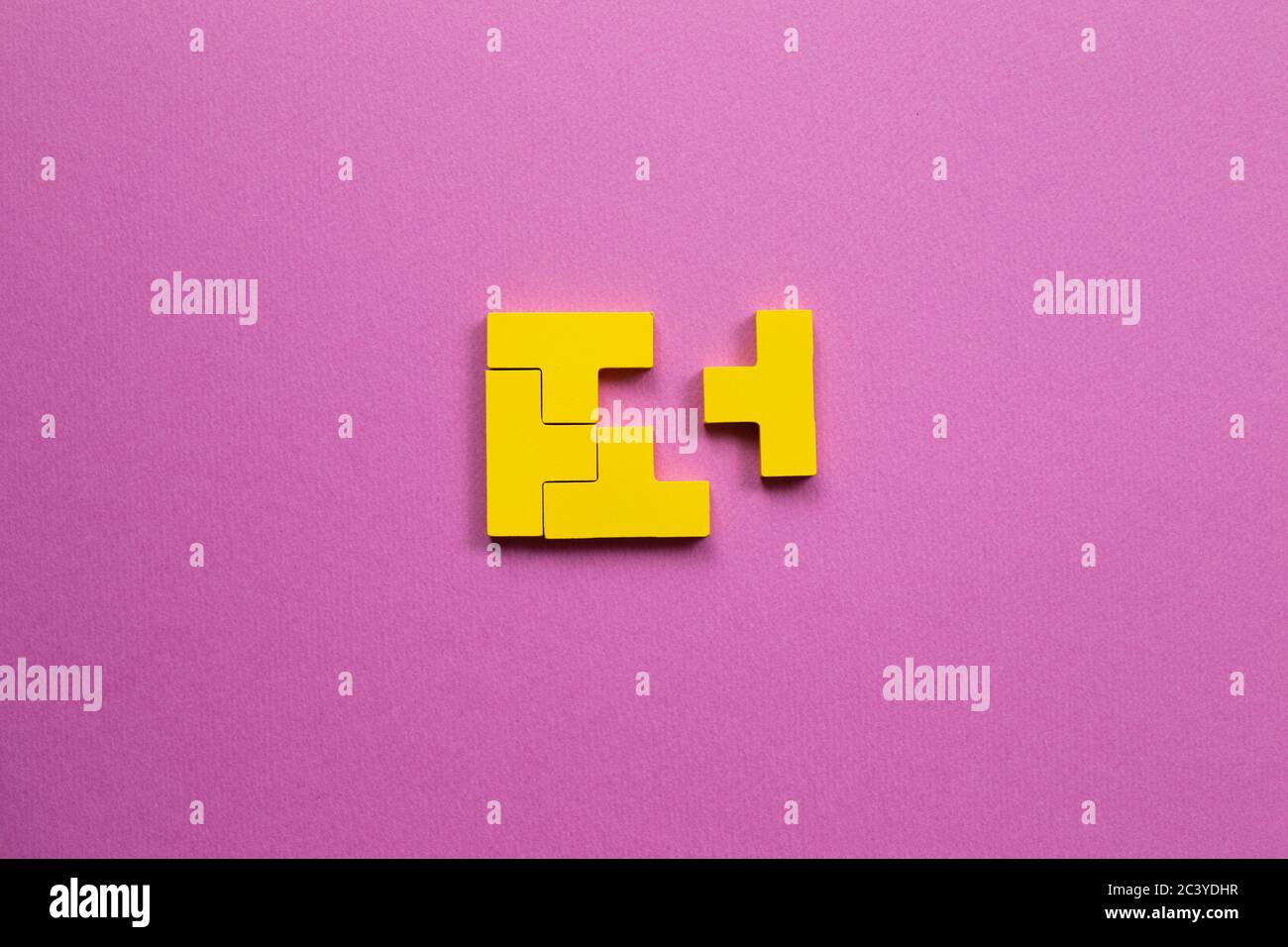 Yellow wooden blocks on pink background. Creative thinking, idea ...