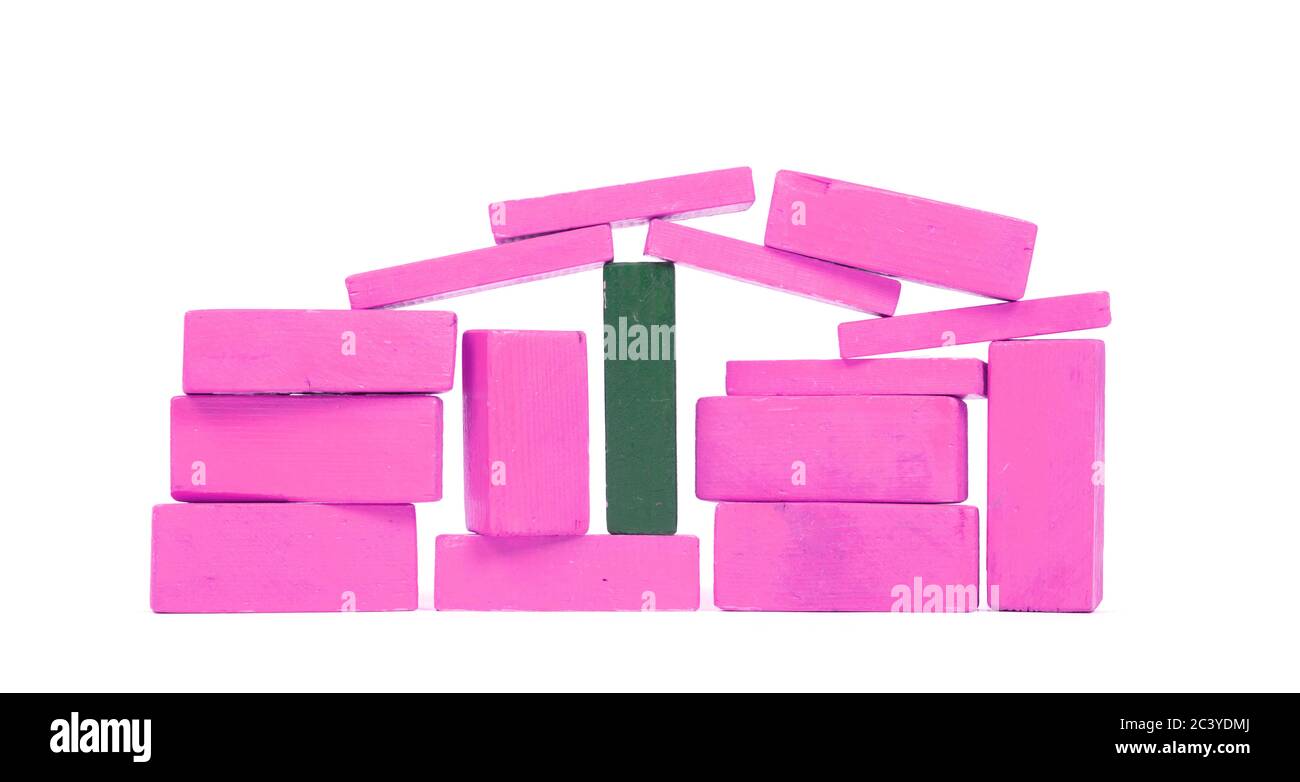 Vintage pink building blocks isolated on white background, one green ...