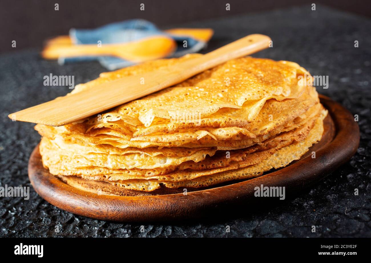 A stack of thin pancakes on a board Stock Photo - Alamy