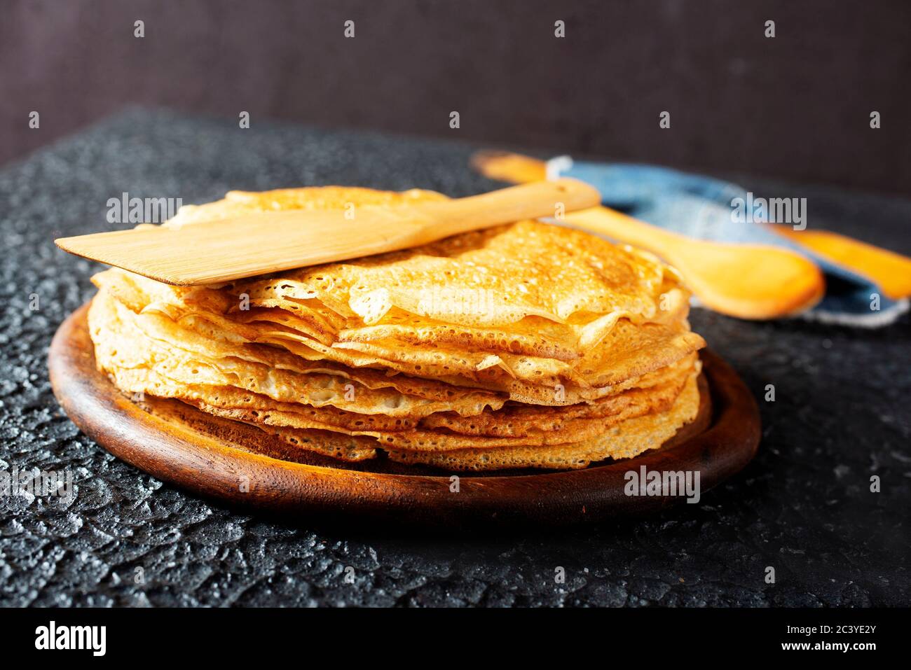 A stack of thin pancakes on a board Stock Photo - Alamy
