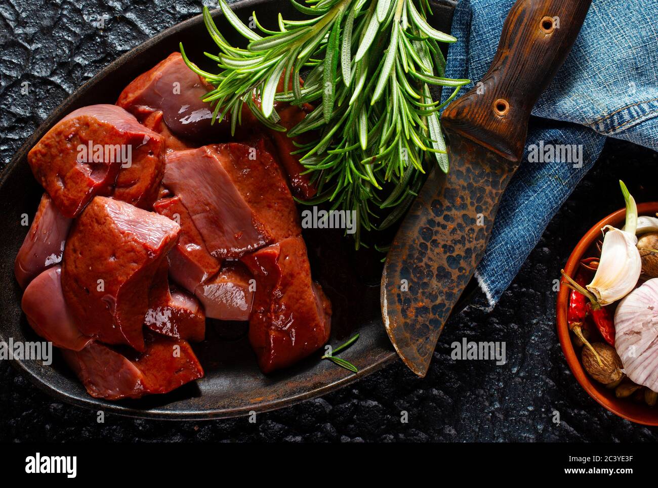 Raw liver on metal plate. Ready to cook. Top view. Dishes from the ...