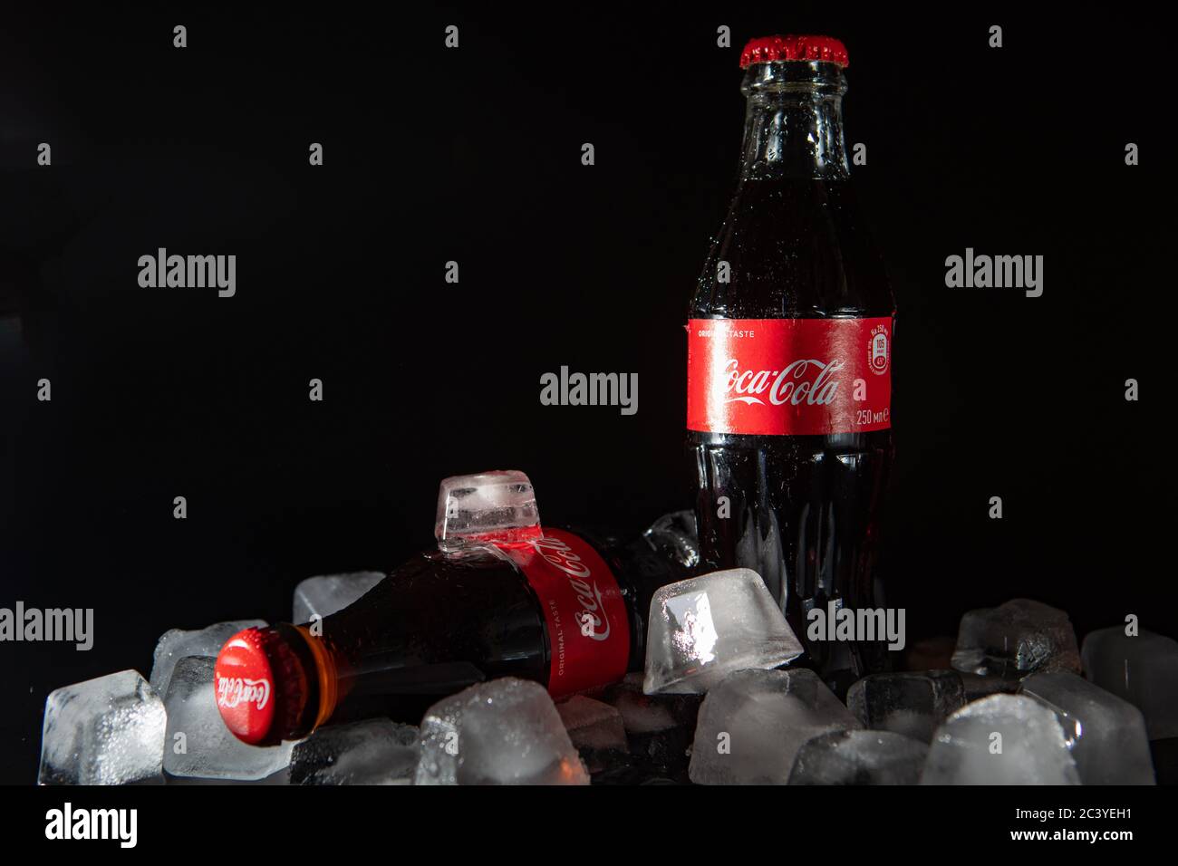 Lviv, Ukraine - May 21, 2020: two glass bottle of coca cola at black ...