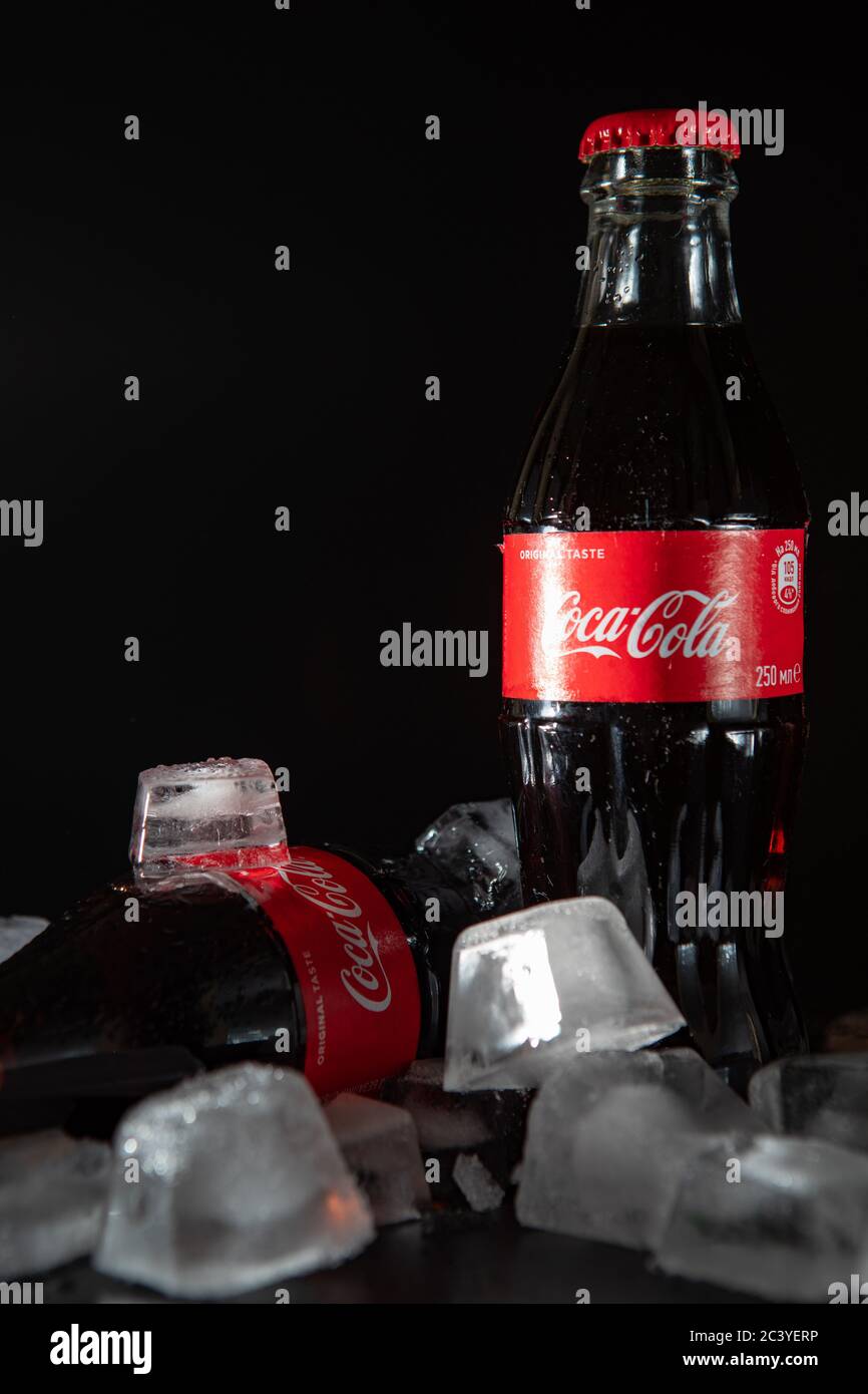 Lviv, Ukraine - May 21, 2020: two glass bottle of coca cola at black ...
