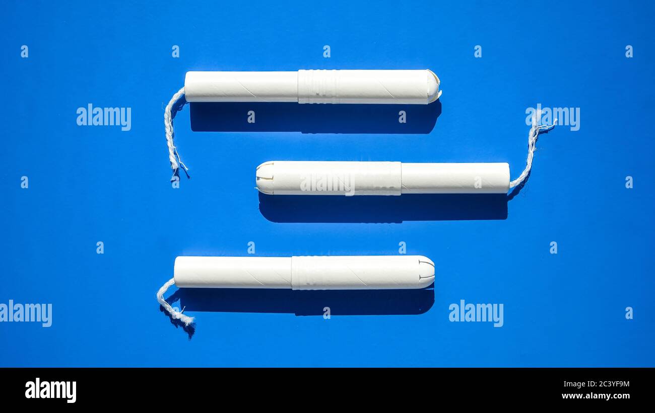 Hygienic tampons on a blue and purple background. copy space ...