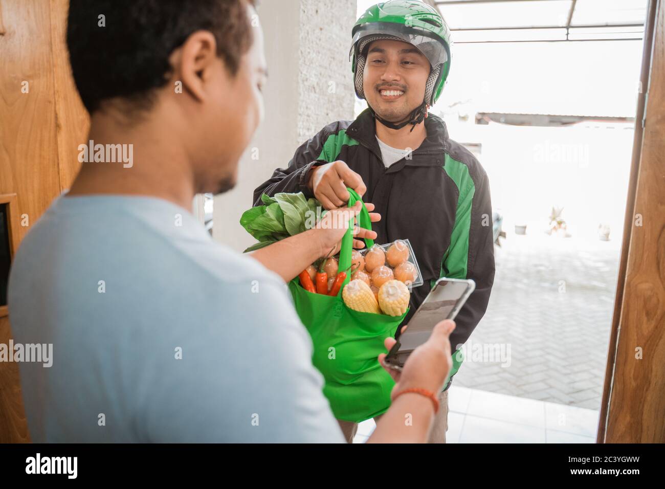 grocery store ordering via smartphone apps. close up hand holding ...