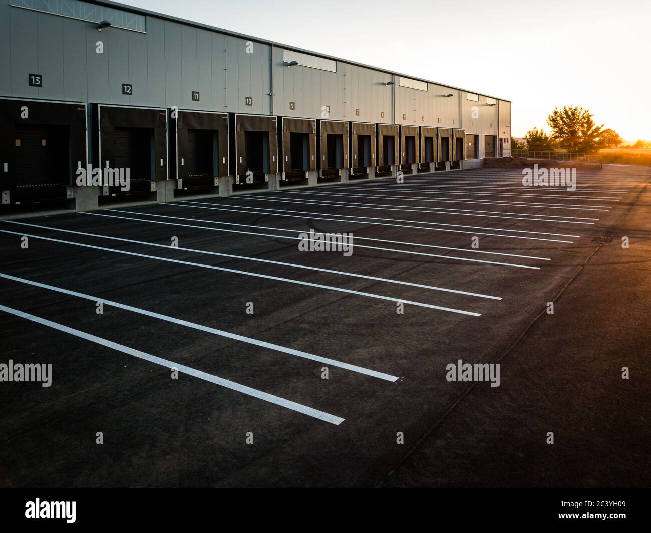 Warehouse exterior with loading ramps and slots for trucks to park ...