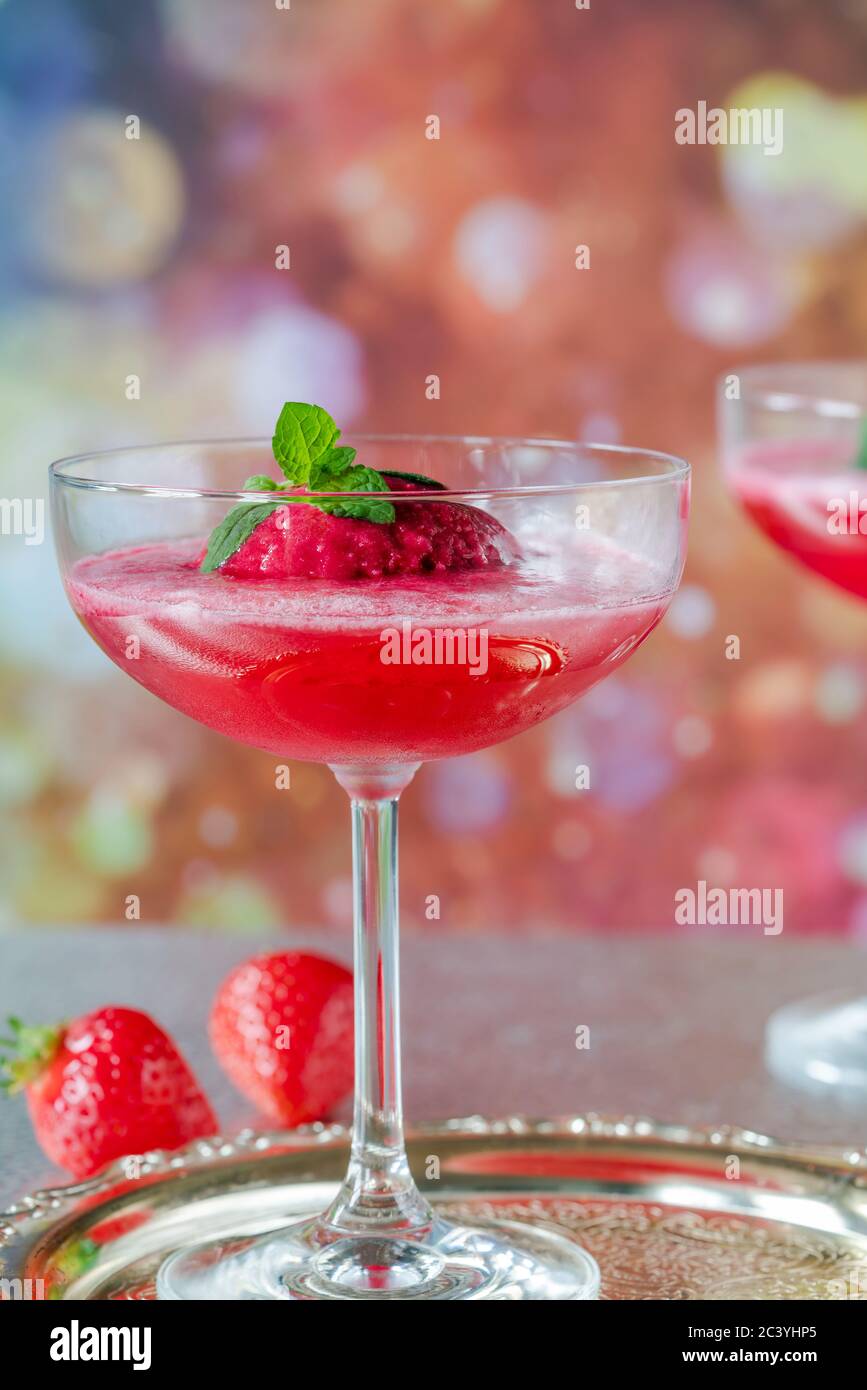 Festive vodka and prosecco cocktail with strawberry sorbet Stock Photo ...