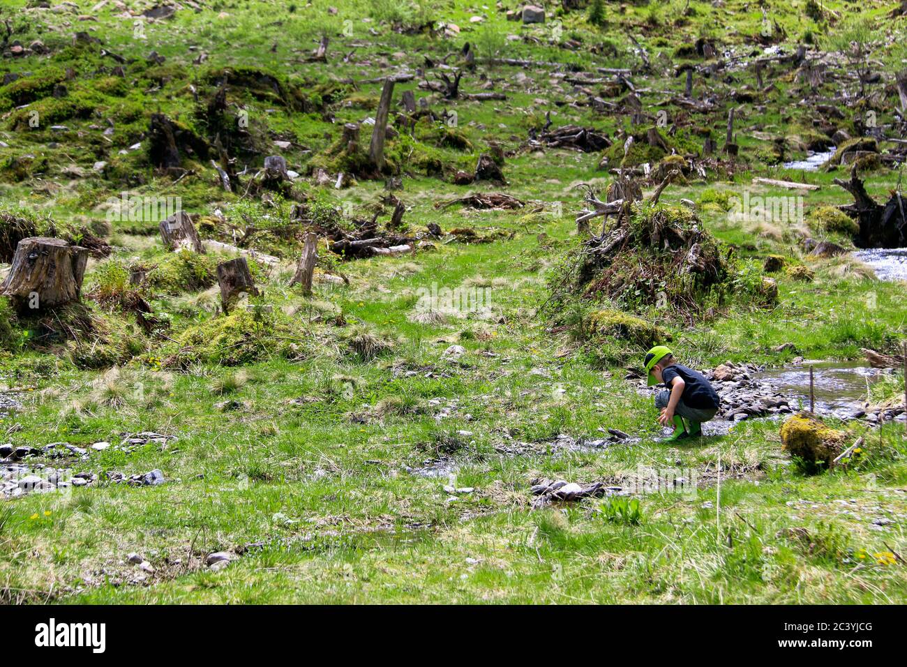 Boy squatting hi-res stock photography and images - Alamy