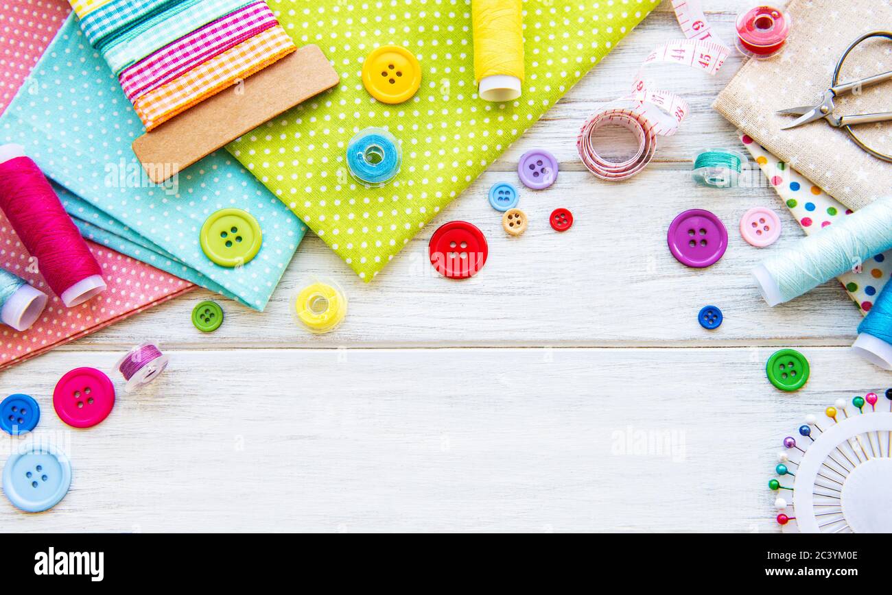 Sewing accessories and fabric on a white background. Sewing threads ...