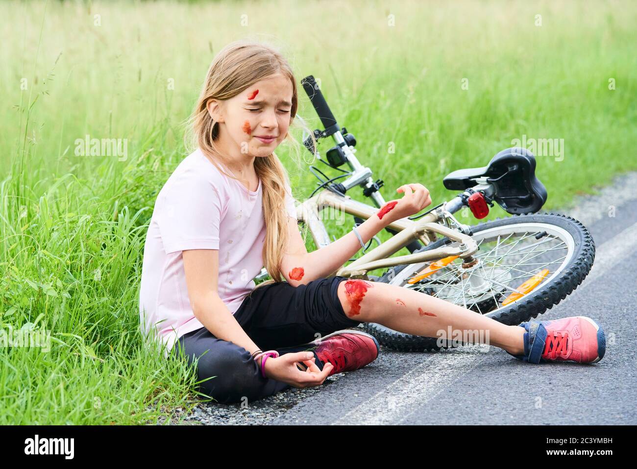 Unhappy girl on bicycle hi-res stock photography and images - Alamy