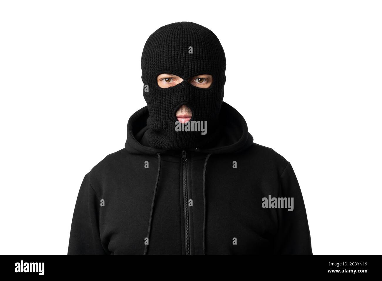 Portrait of masked thief isolated over white studio wall Stock Photo ...