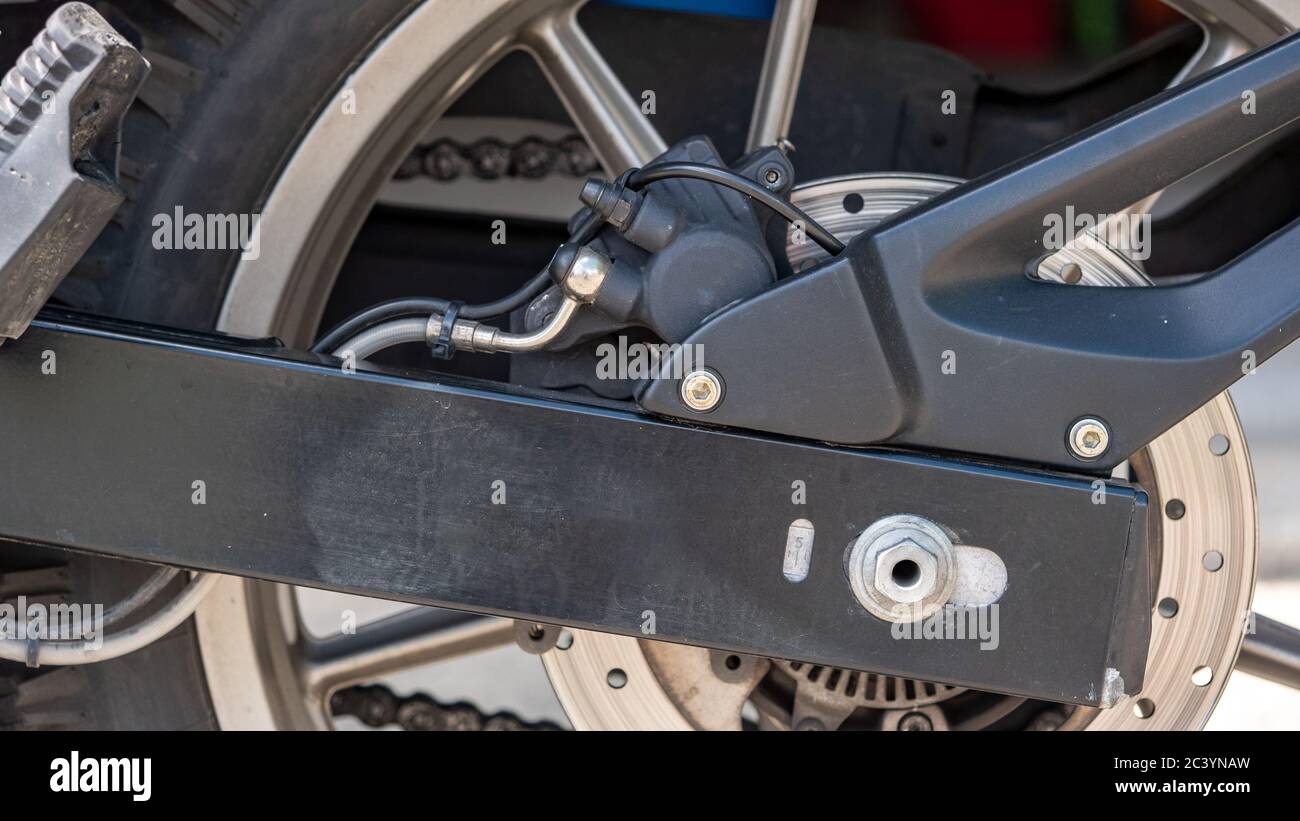 a detail of the rear brake of the motorcycle Stock Photo - Alamy