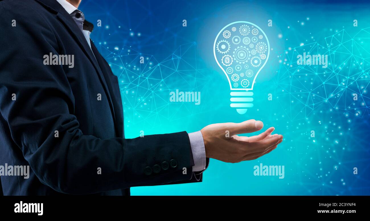 Innovative Business Solutions. Businessman Holding Abstract Light Bulb ...