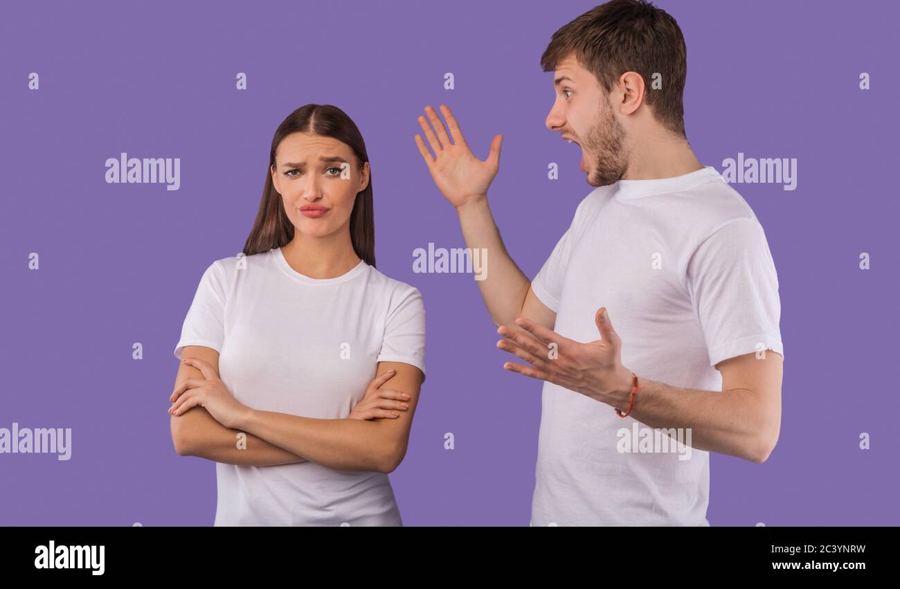 Young guy arguing with his girlfriend who ignoring him Stock Photo - Alamy