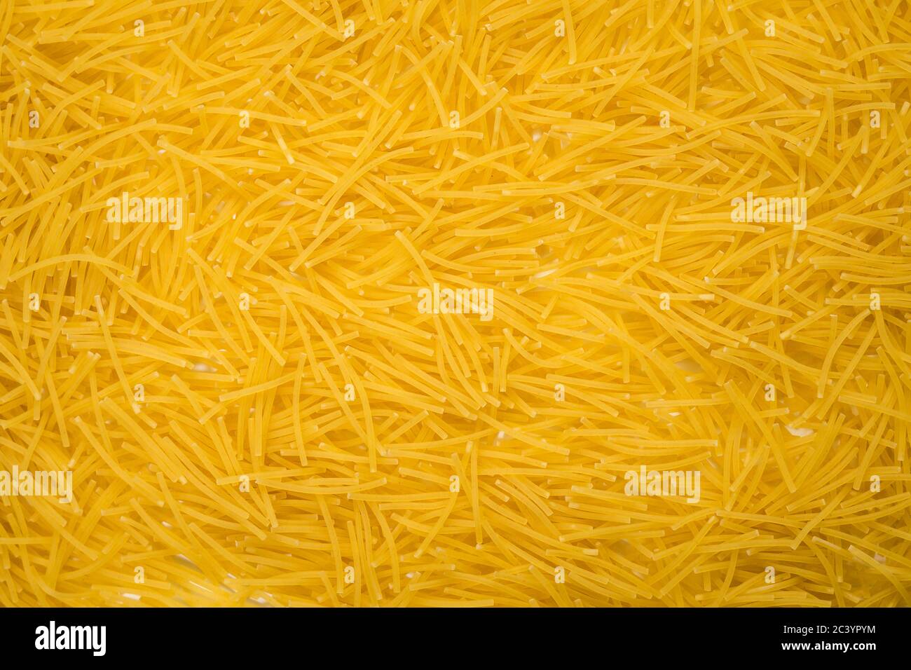 Dry vermicelli pasta ready for cooking. close up with copy space. Food ...
