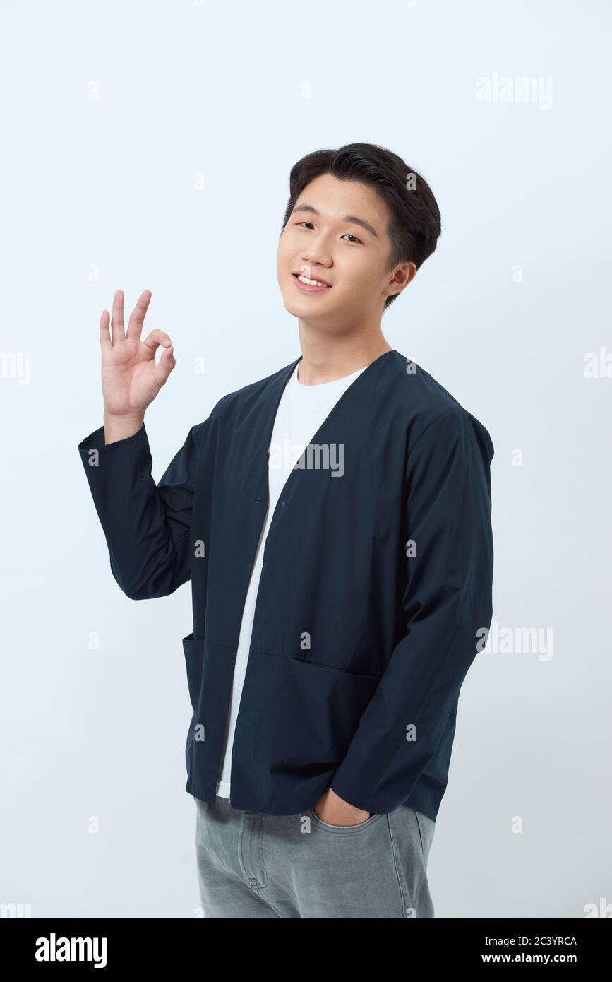Ok sign cheerful young man hi-res stock photography and images - Alamy