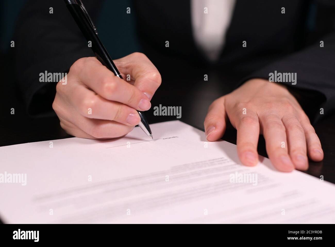 Woman signs a contract, close-up of hands with pen on paper Stock Photo ...