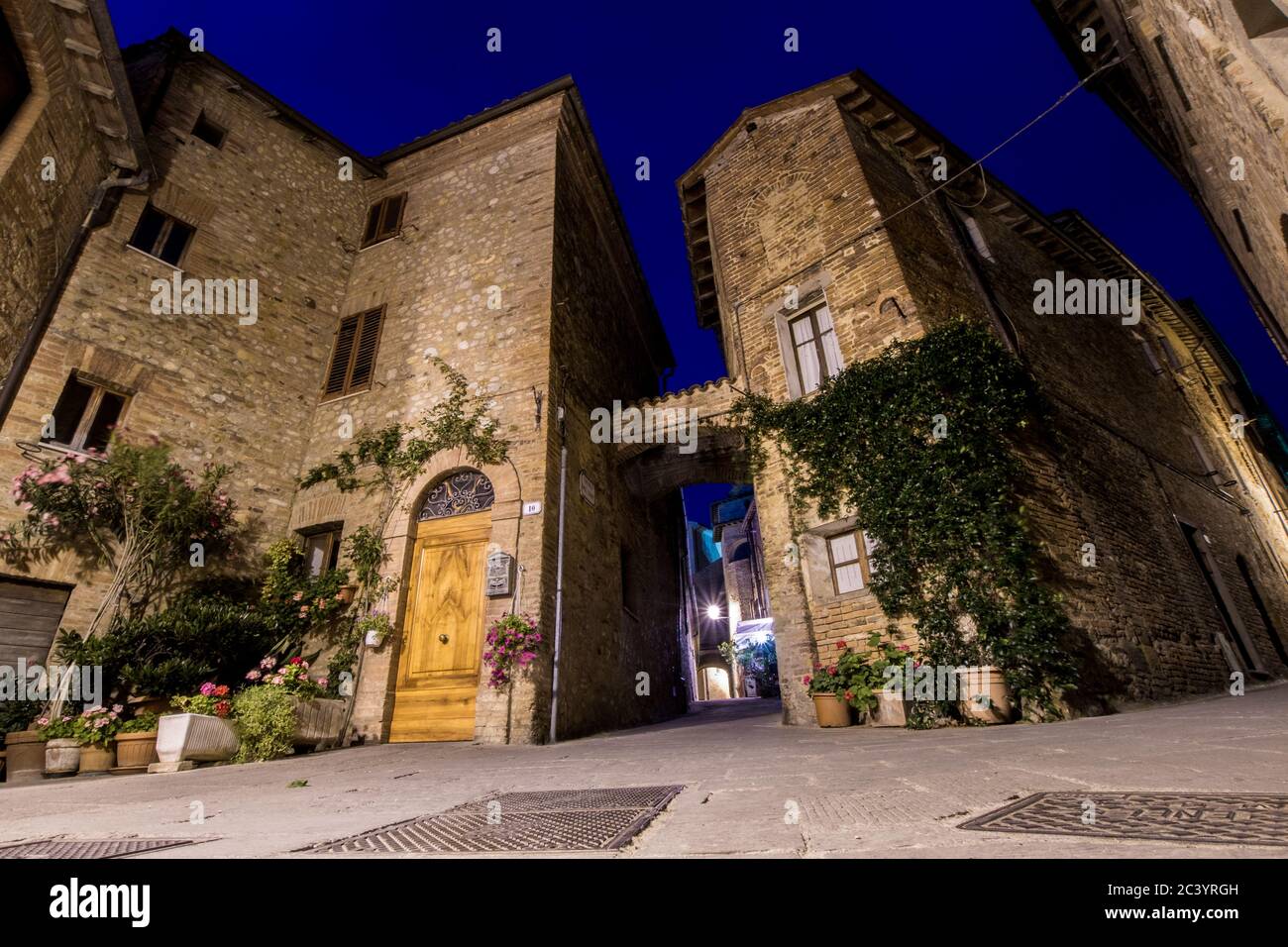 Little square of a small ancient Italian town, with brick houses, a ...
