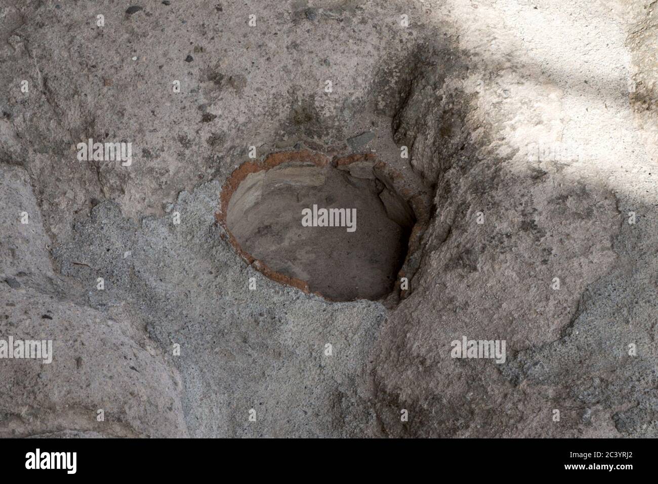 Recess in rock for vase with vase remains in-situ. Rock-cut city and ...