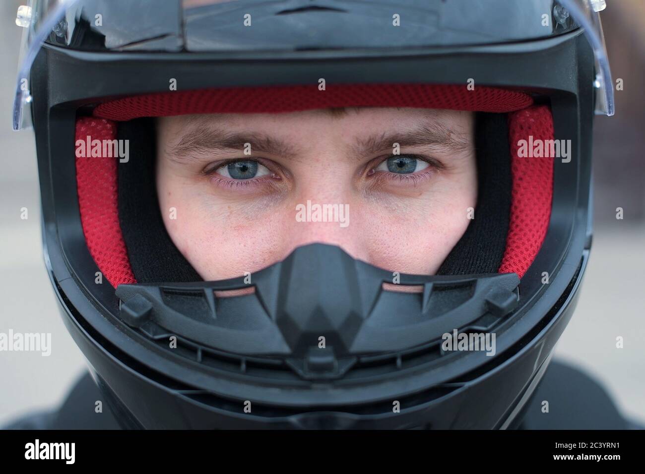 Direct view of a motorcyclist in a helmet with an open visor Stock ...