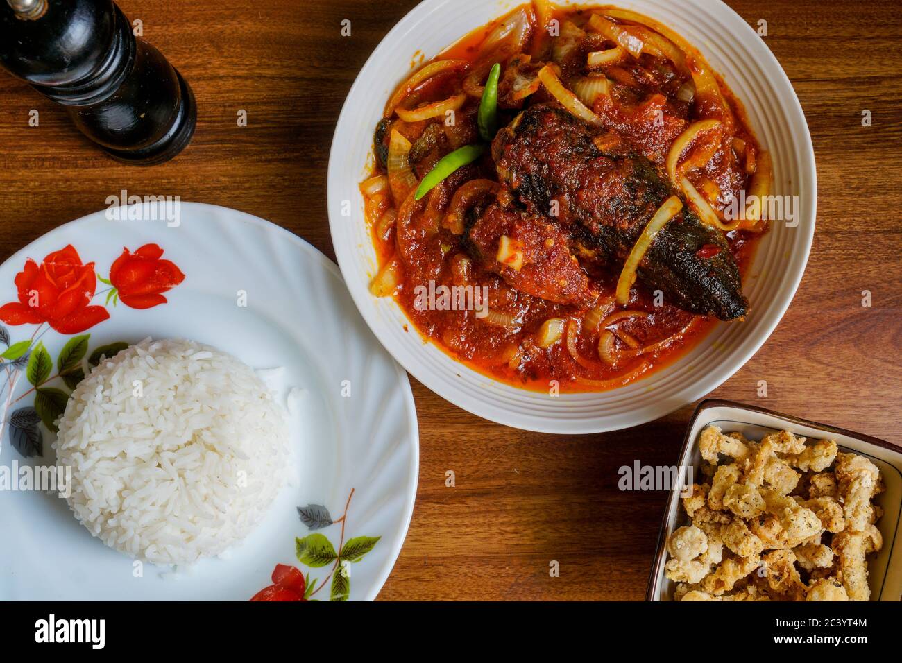 Fried silver catfish cooked with spicy sambal red chilli and onion with ...