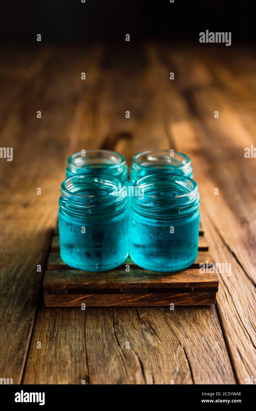 Blue colored alcoholic shooters hi-res stock photography and images - Alamy