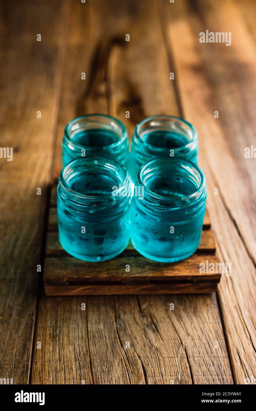 Blue colored alcoholic shooters hi-res stock photography and images - Alamy
