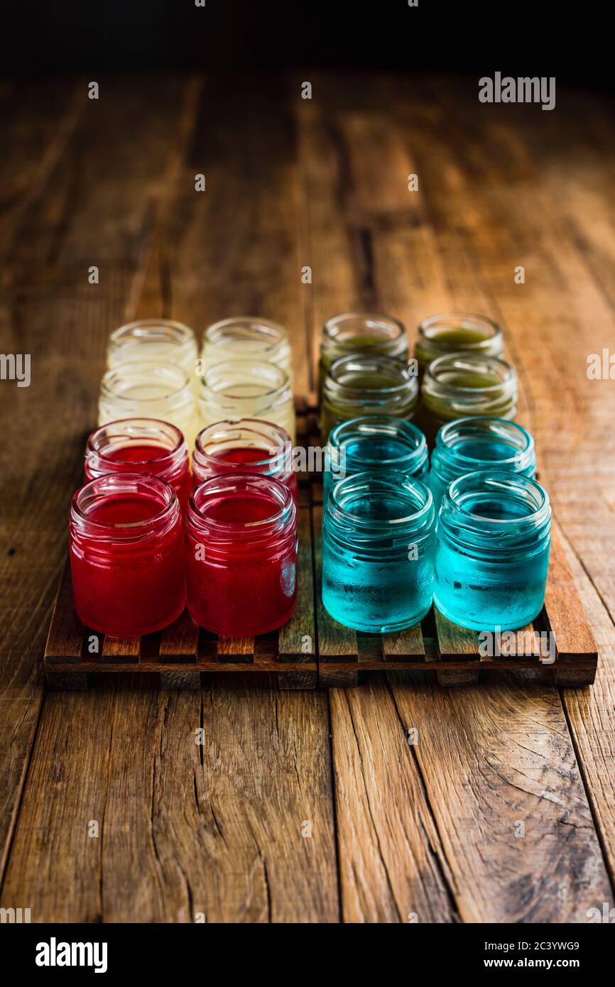 Different kinds of alcoholic shooters or shots, red, green, yellow ...