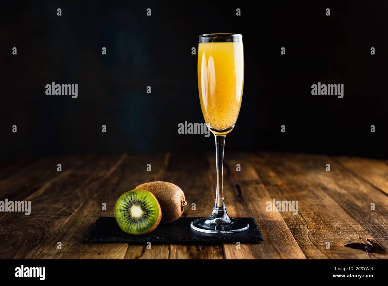 A sparkling cocktail with kiwi in a flute glass Stock Photo - Alamy