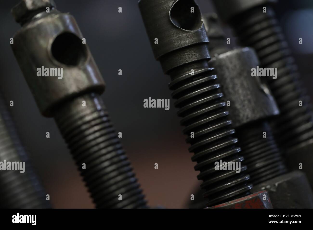 Collection of metallic automotive parts on gray background Stock Photo ...