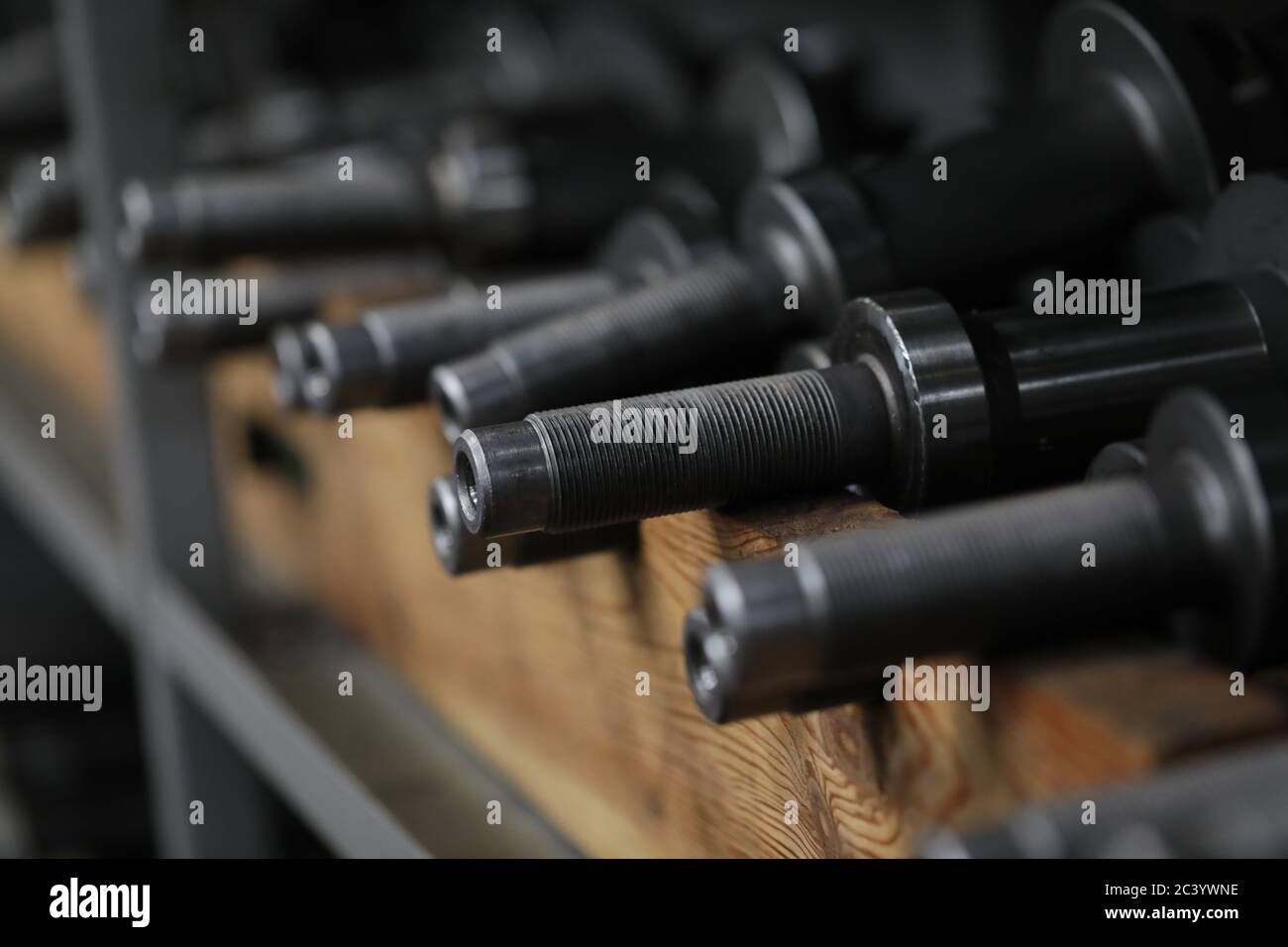 Set of metallic automotive parts in auto repair shop Stock Photo - Alamy