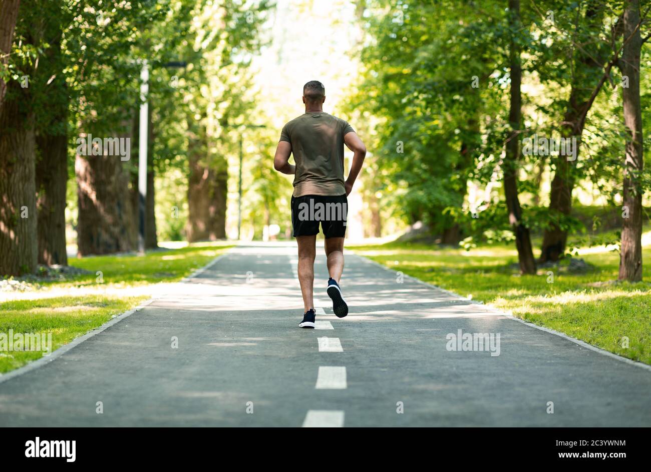 Back view young sportsman running hi-res stock photography and images ...