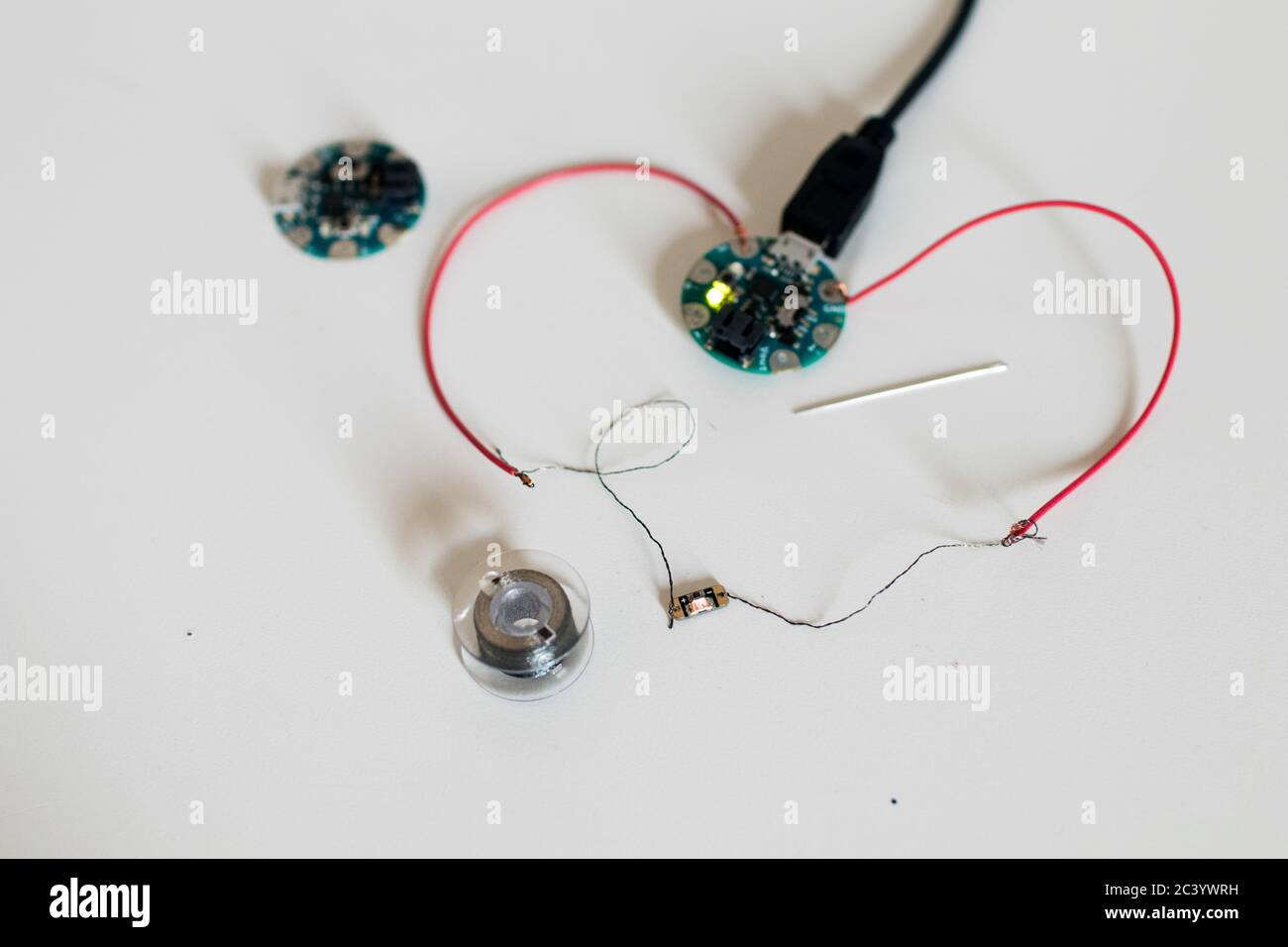 prototype of a wearable device with a home-made sewable microcontroller ...