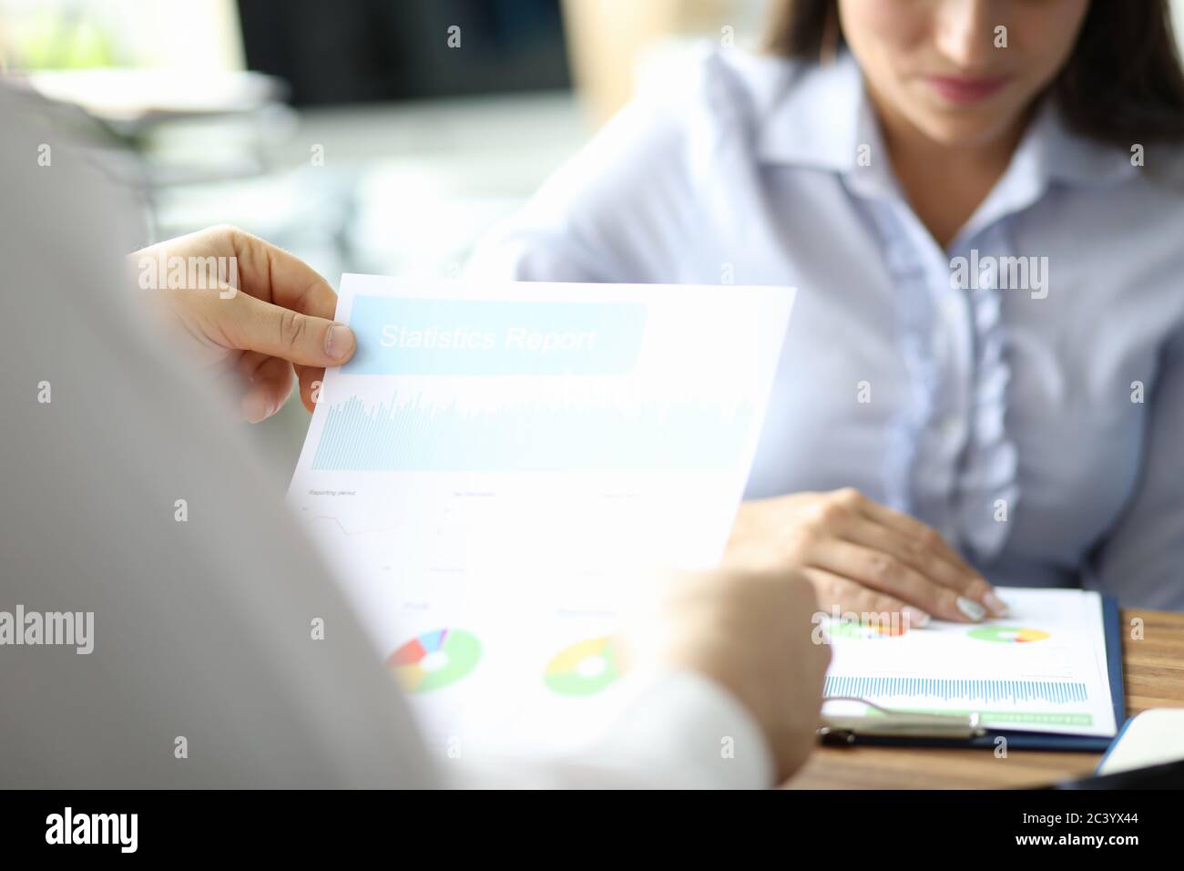Office workers are studying documents at work Stock Photo - Alamy