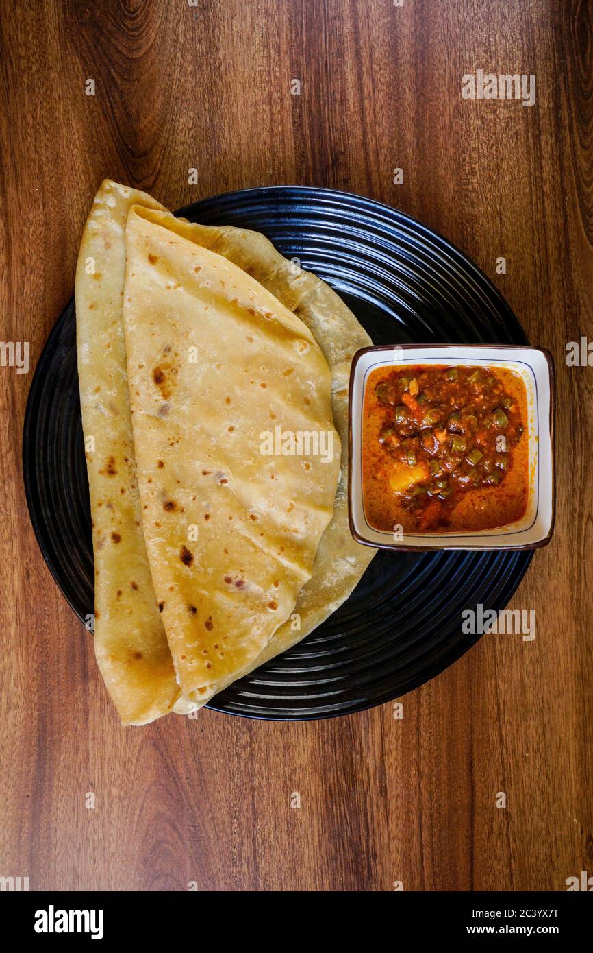 Chapati with curry hi-res stock photography and images - Alamy