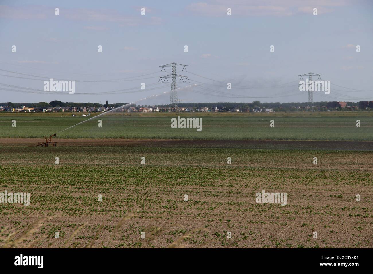 Farmers are watering there agriculture land due to the dryness in the ...
