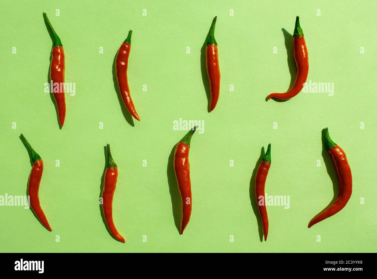 Red chilli peppers pattern on green background. Top view. Hot pepper ...