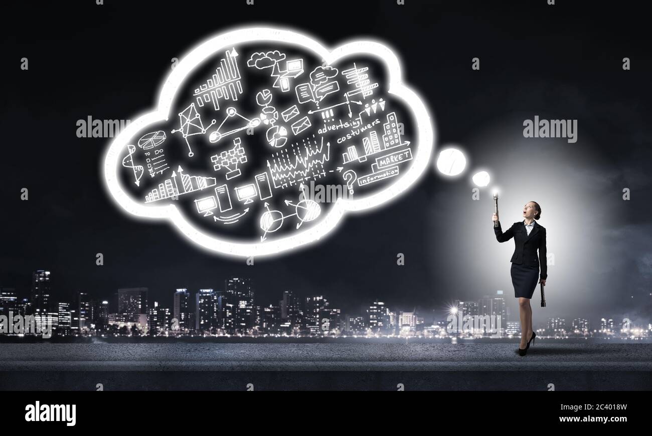 Woman throwing light on her ideas Stock Photo - Alamy