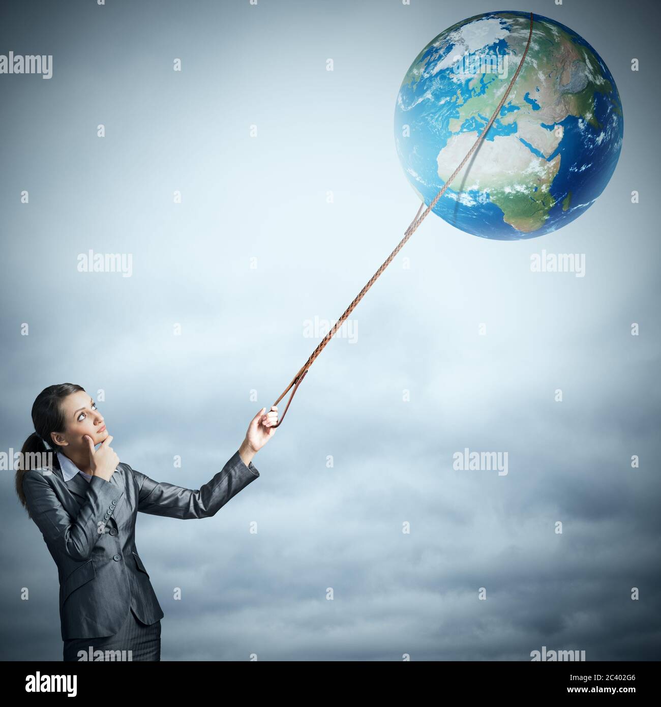 Woman catch Earth planet Stock Photo - Alamy