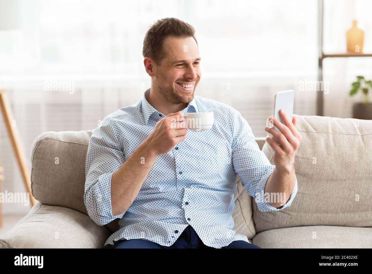 Man using smartphone video chat hi-res stock photography and images - Alamy