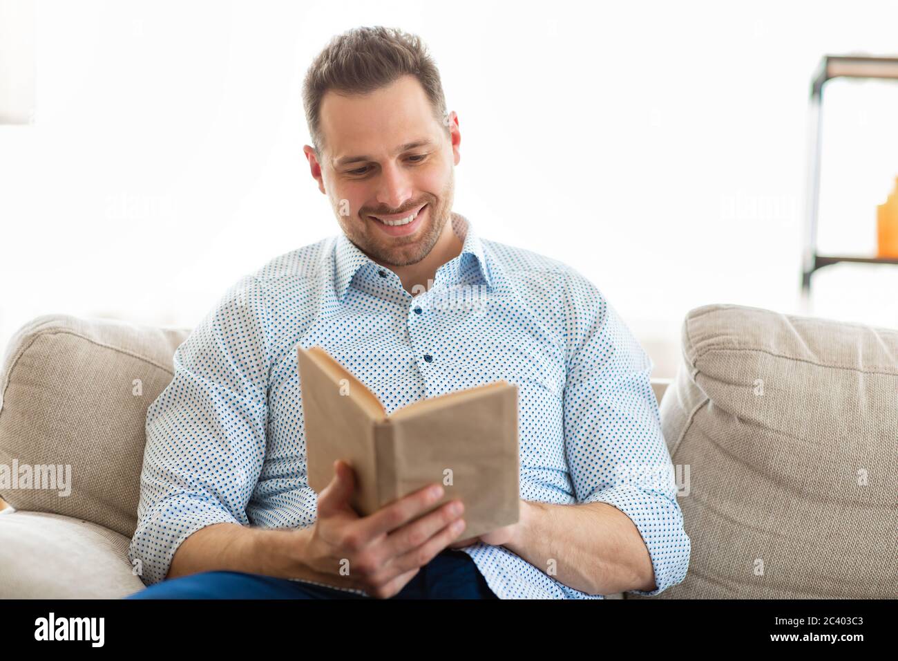 Smart guy reading book hi-res stock photography and images - Alamy