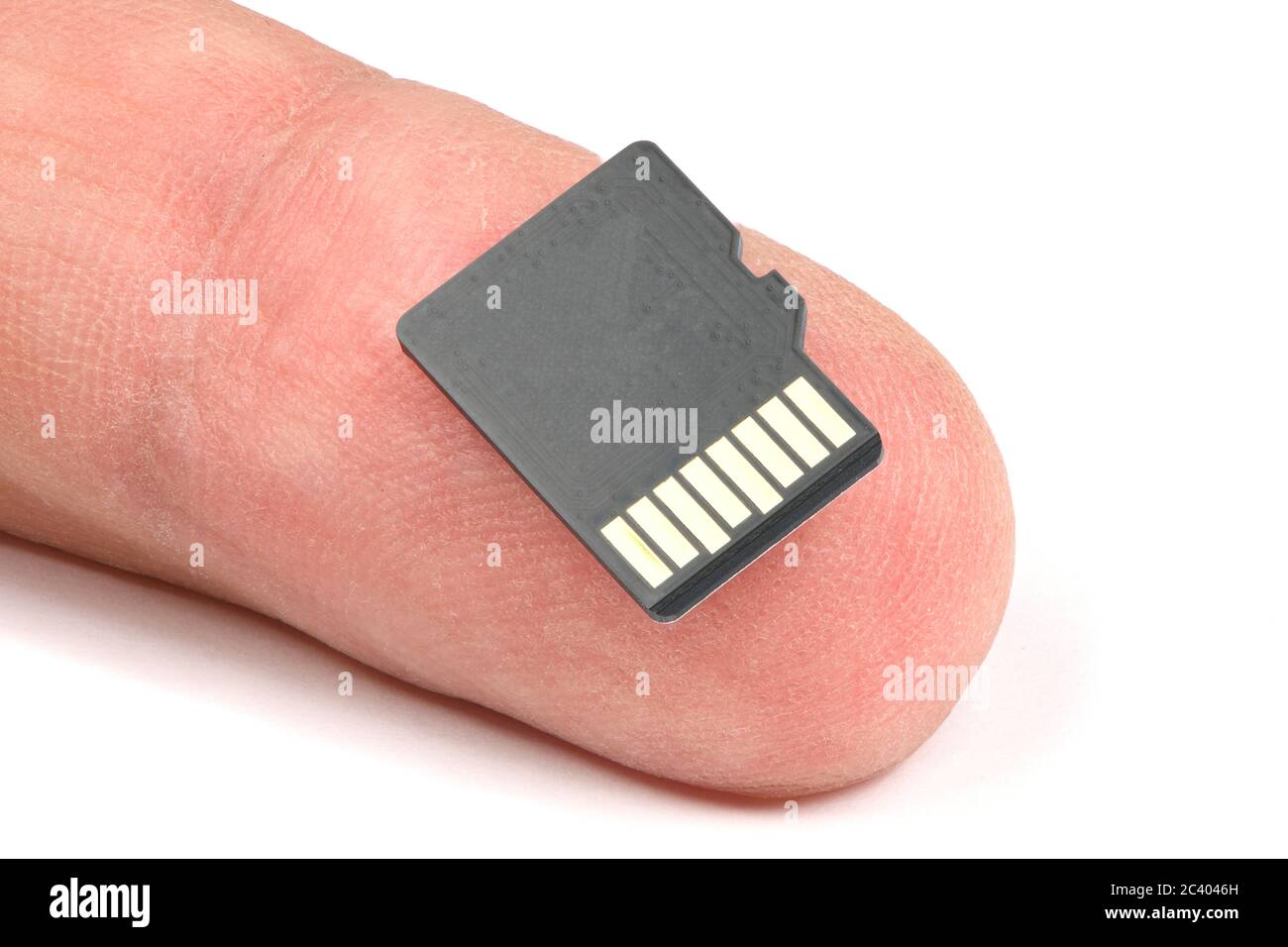 SD memory card on finger isolated on white background. High resolution ...