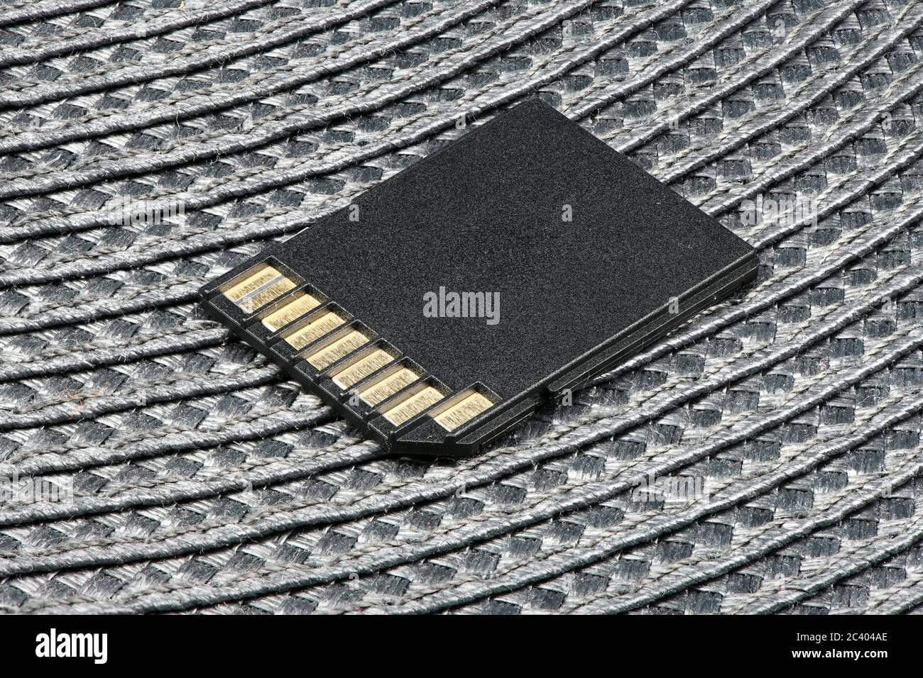 SD memory card on grey tissue background. High resolution photo. Full ...