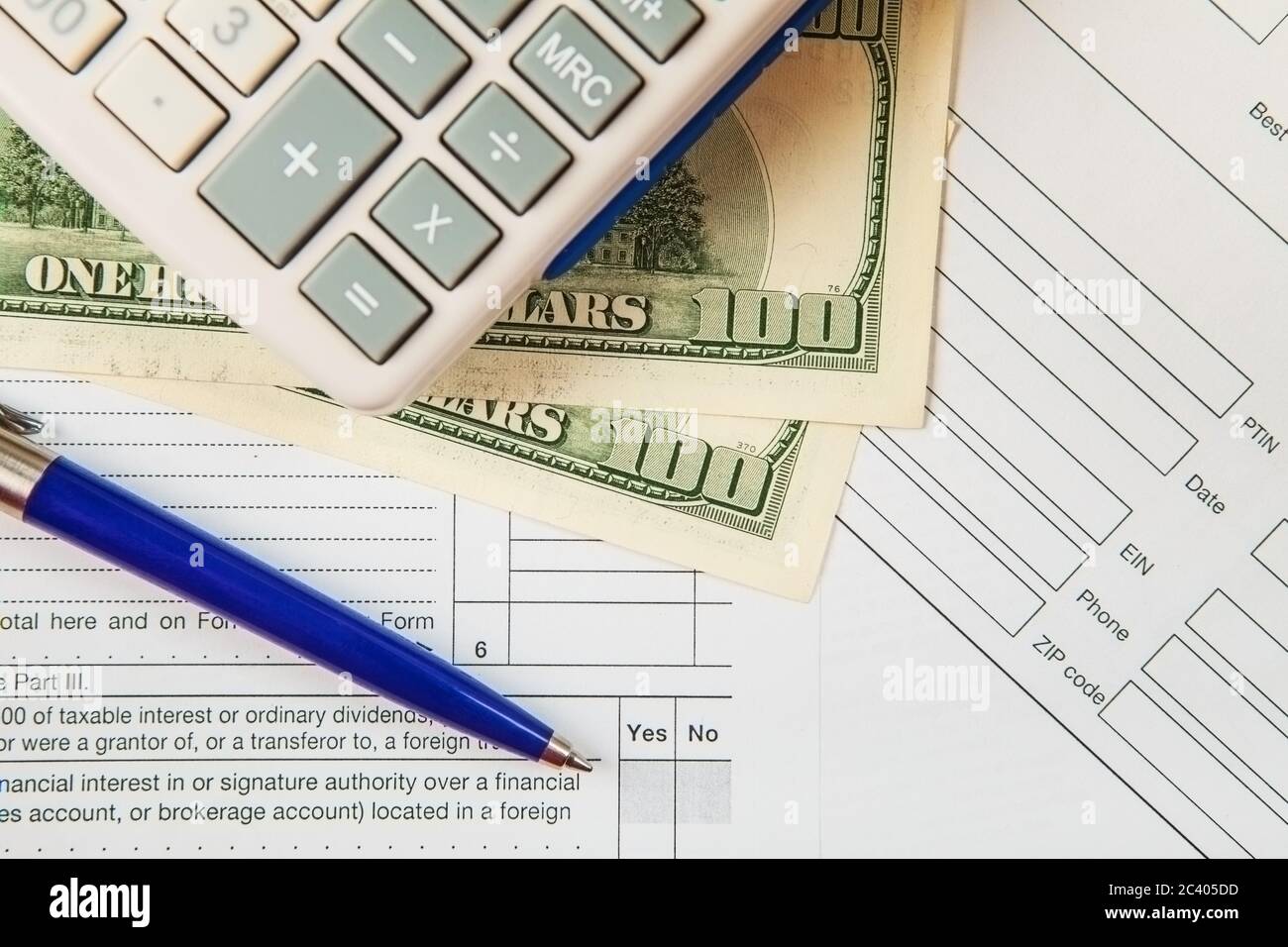 Tax form, calculator, pen and dollar bills Stock Photo - Alamy
